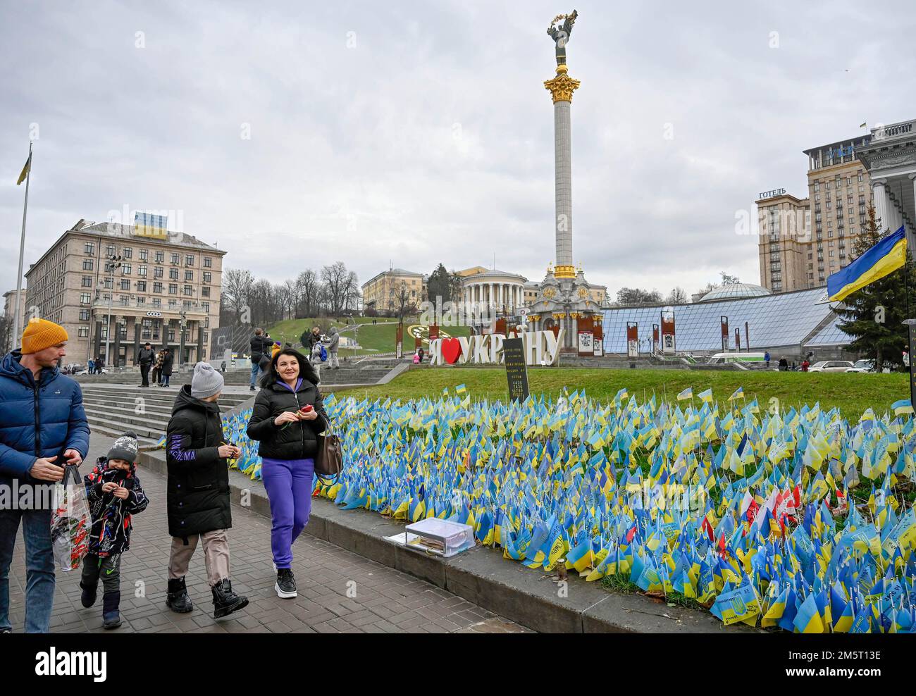 People are seen walking along the Independence Square in central of ...