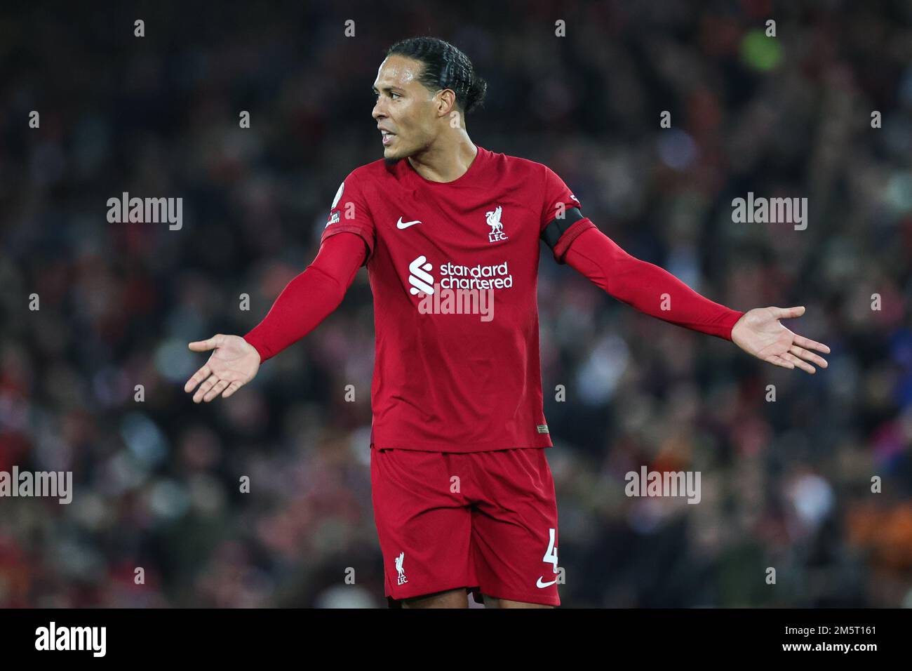 Virgil van Dijk #4 of Liverpool reacts during the Premier League match ...