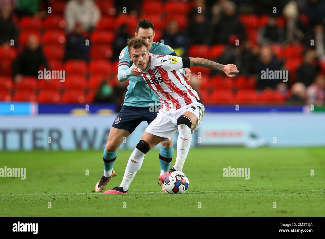Stoke On Trent, UK. 30th Dec, 2022. Josh Tymon of Stoke City shields ...