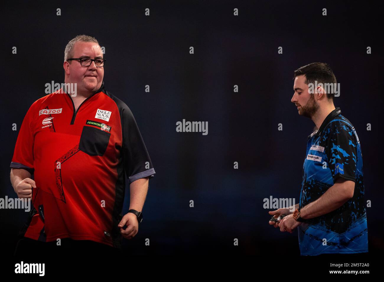 Stephen Bunting reacting as Luke Humphries looks on during day thirteen ...
