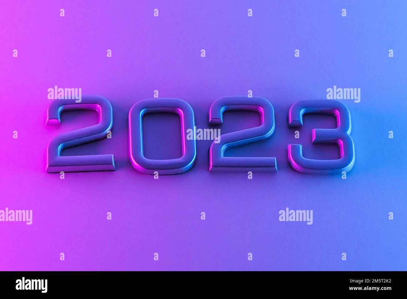 The numbers 2023 in neon light. New Year 2023 on a blue pink background ...