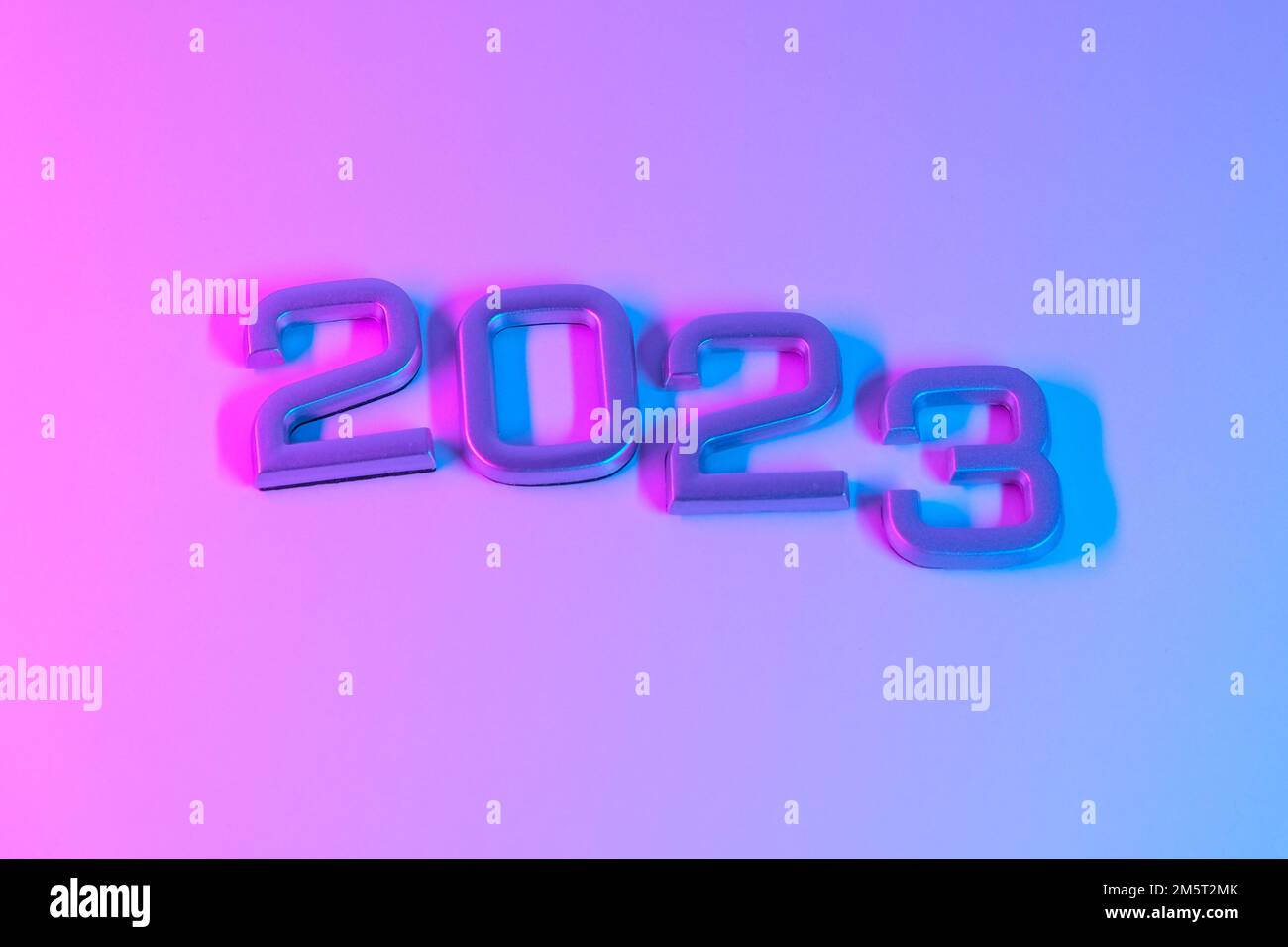 The numbers 2023 in neon light. New Year 2023 on a blue pink background ...