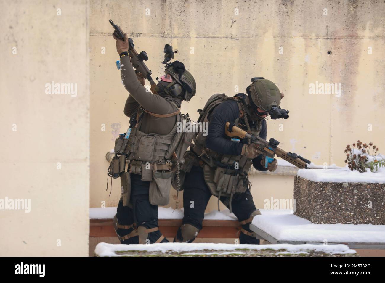 One Spezialeinsatzkammando (SEK) trainee covers his teammate as he ...