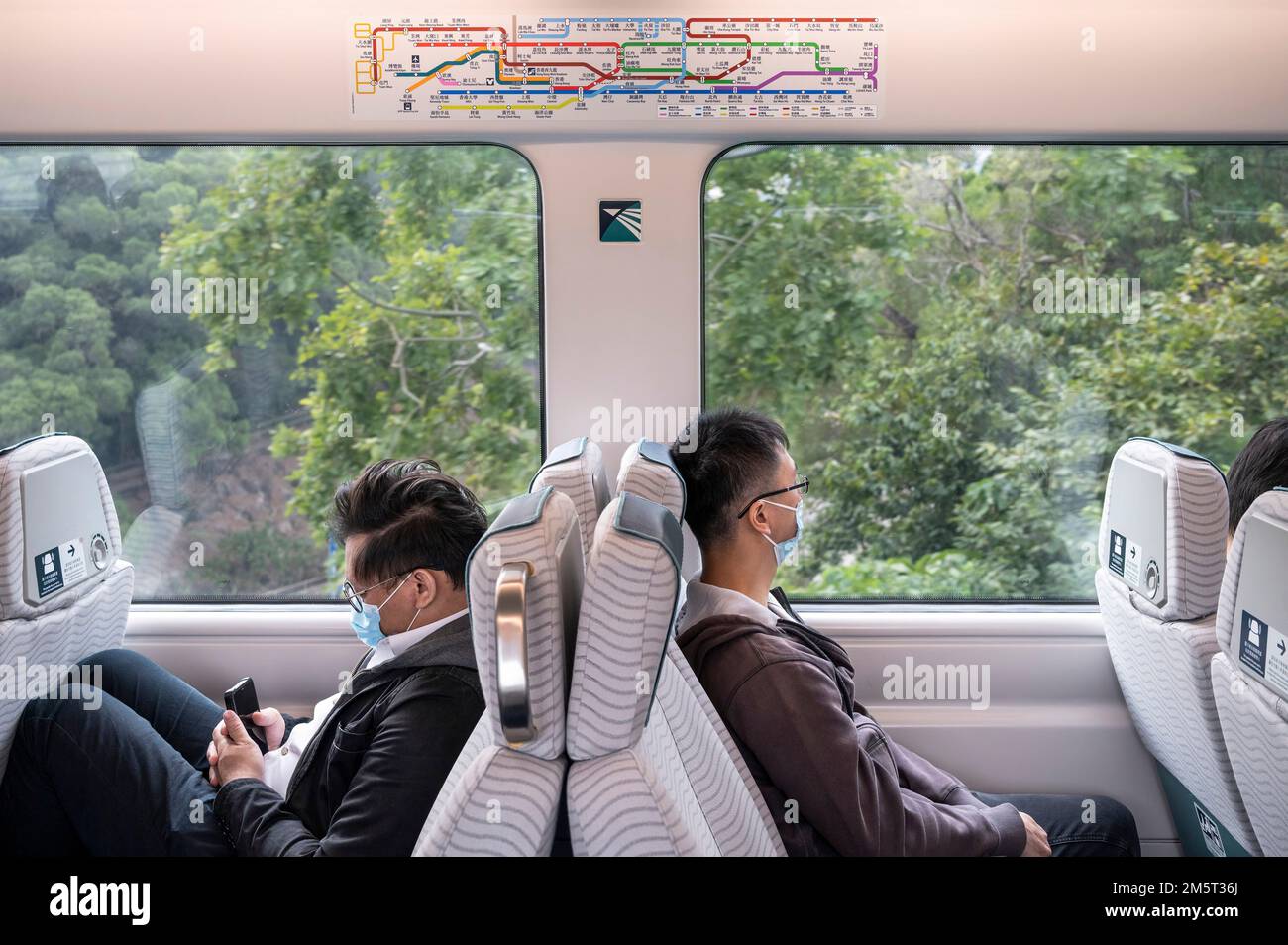 Hong Kong, China. 29th Dec, 2022. Passengers ride on the MTR Express train with the destination ...