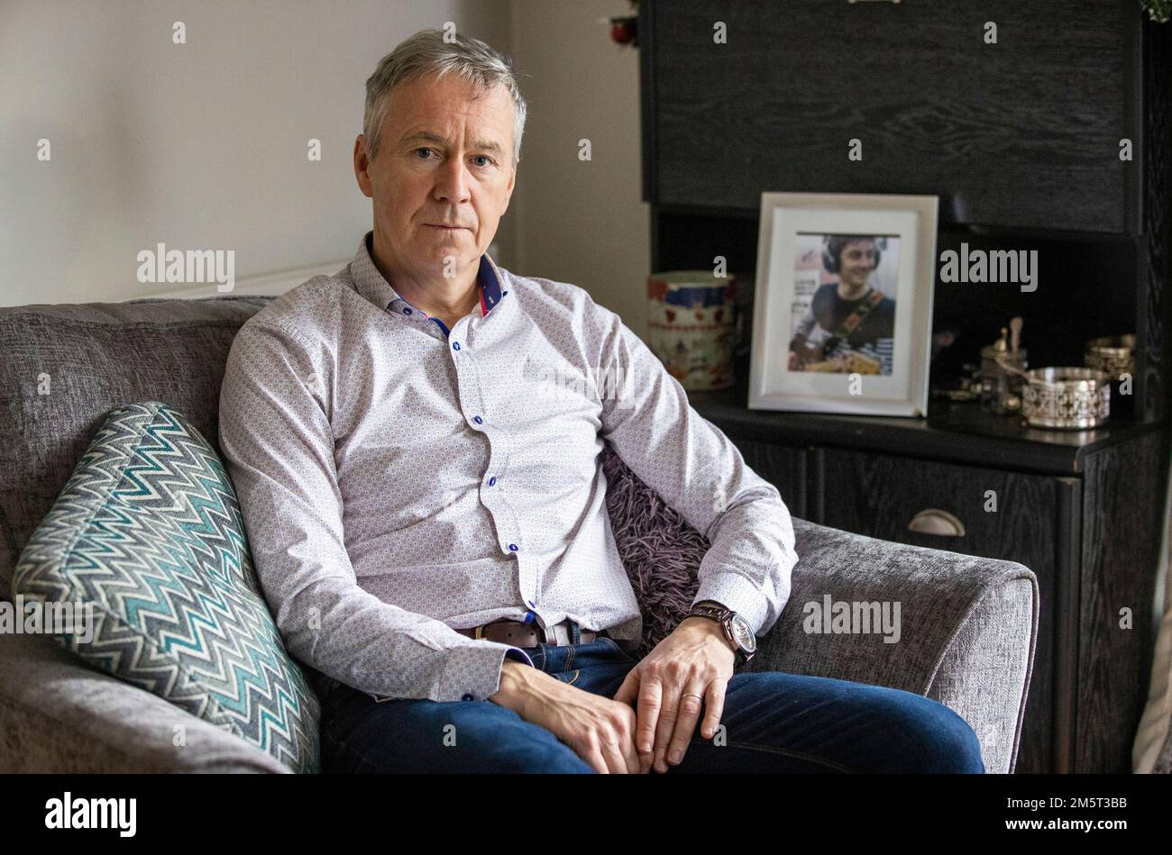 Peter Dolan, sitting beside a picture of his son Enda Dolan, at his home in Omagh. Peter Dolan ...