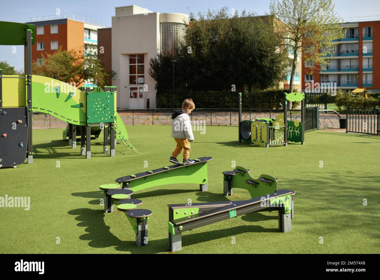 Boy playing on the playground in Europe Stock Photo - Alamy