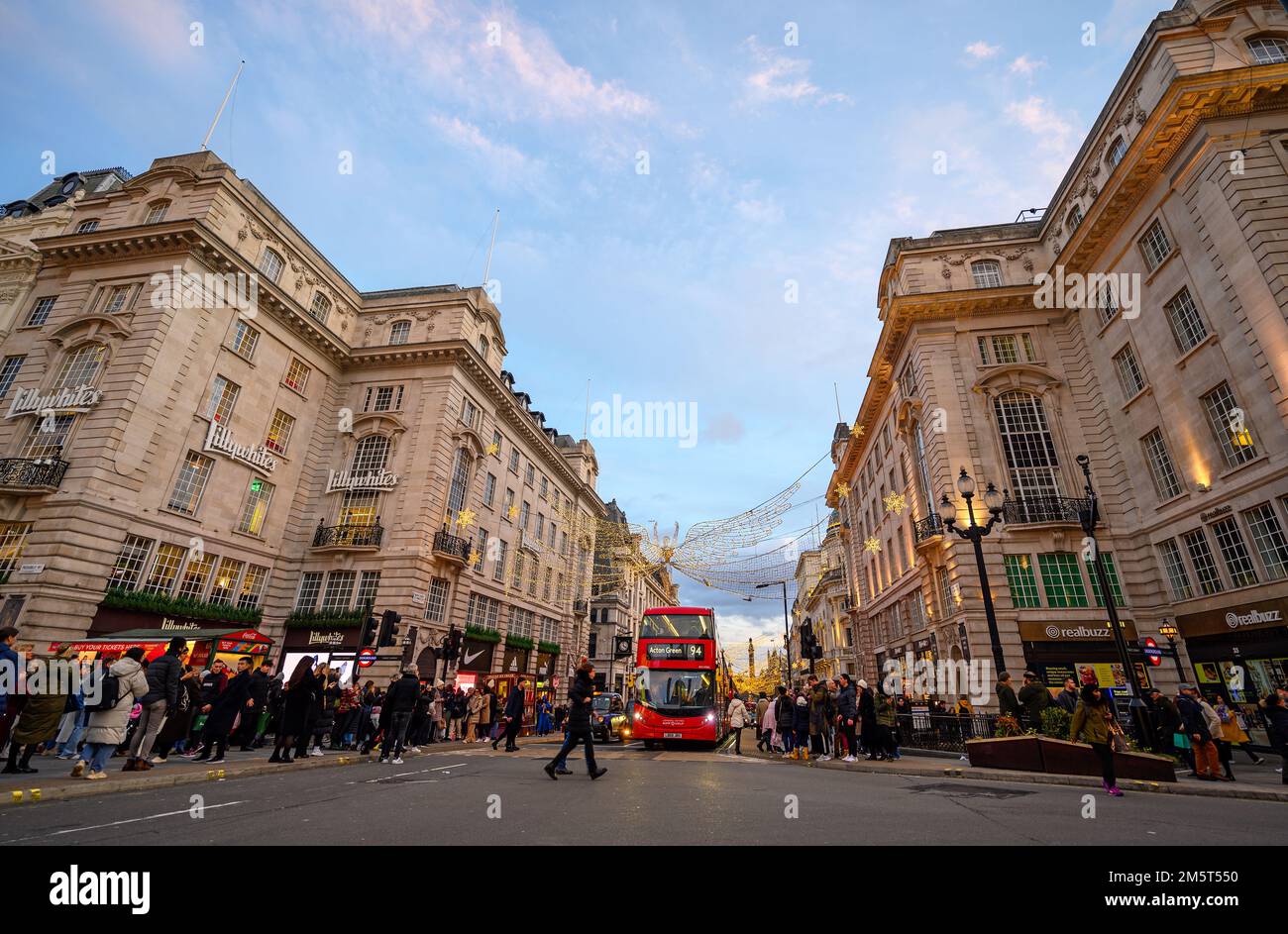 People and traffic at Piccadilly Circus in London, UK. This is an ...