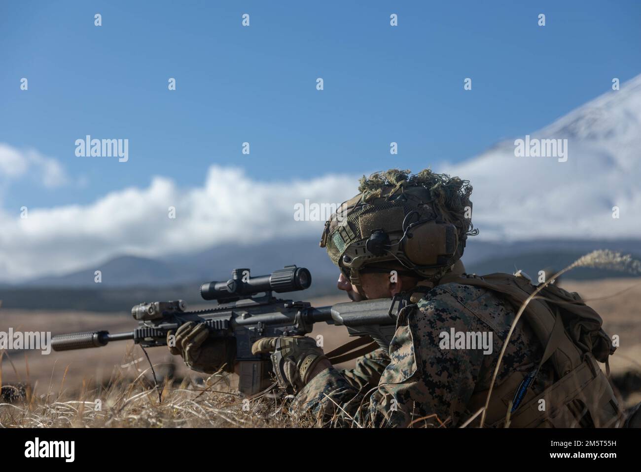 A U.S. Marine with 1st Battalion, 2d Marines fires an M27 Infantry ...