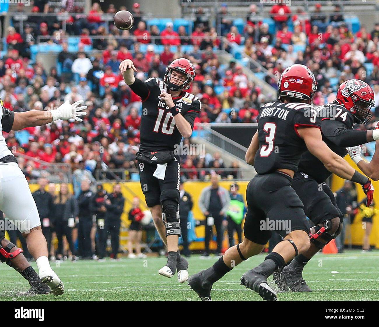 December 30, 2022: Ben Finley (10) of NC State passes the ball. NCAA ...