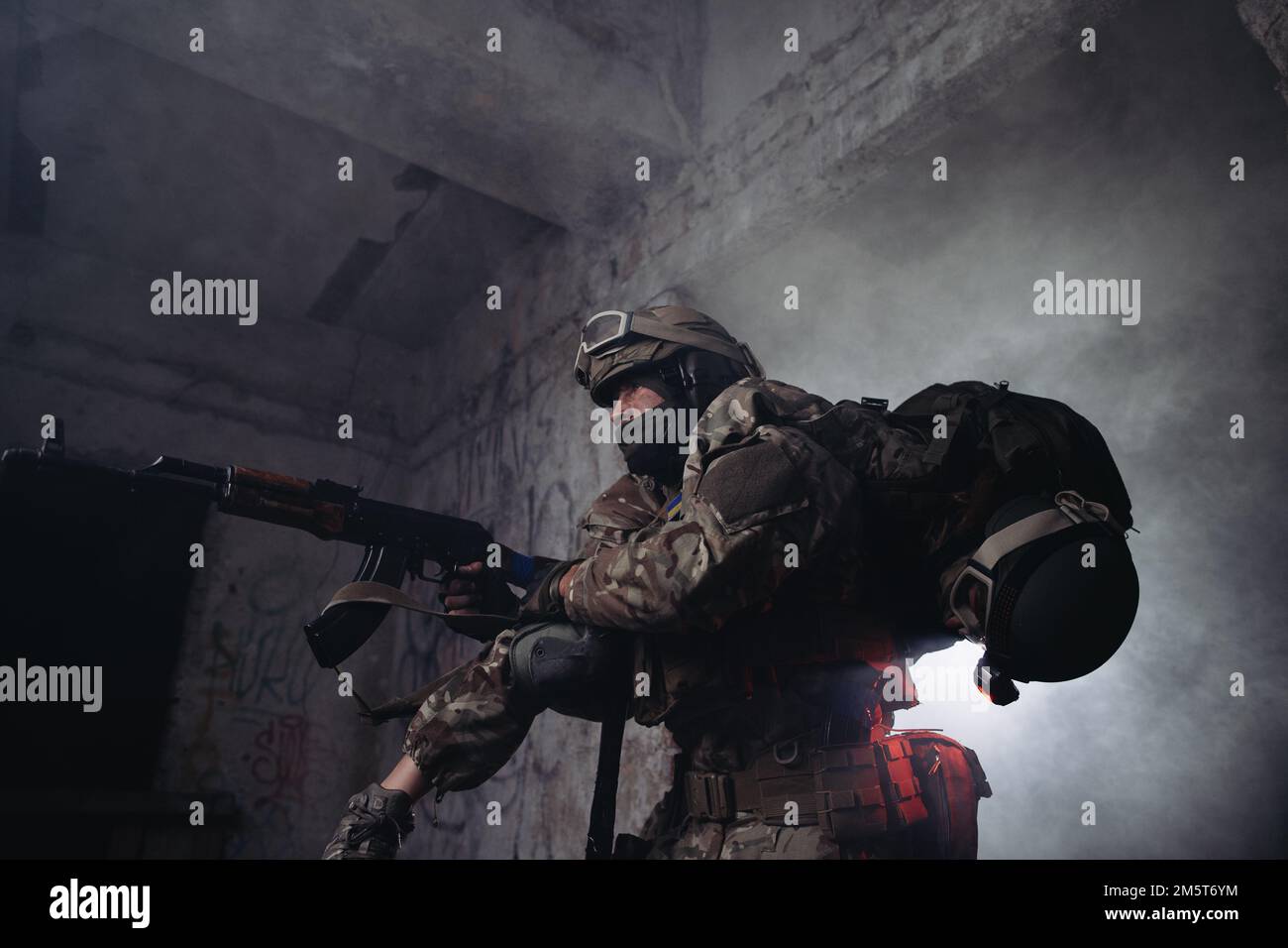 Evacuation of a wounded soldier. A soldier carries his wounded brother ...