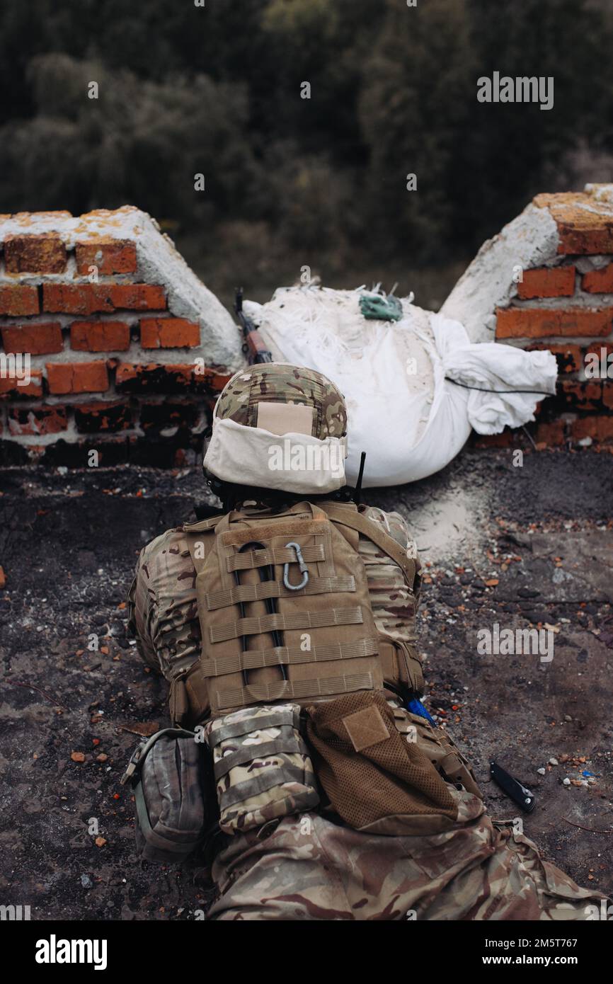 The Ukrainian military is defending its positions. Soldier in war, with ...