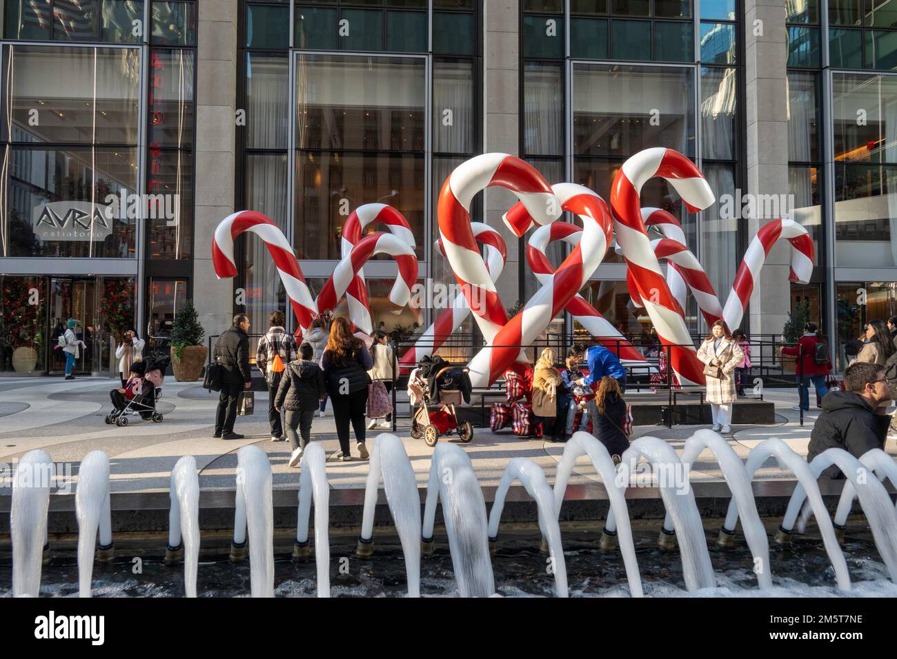Giant candy canes deck the plaza in front of Avra Estiatorio restaurant ...