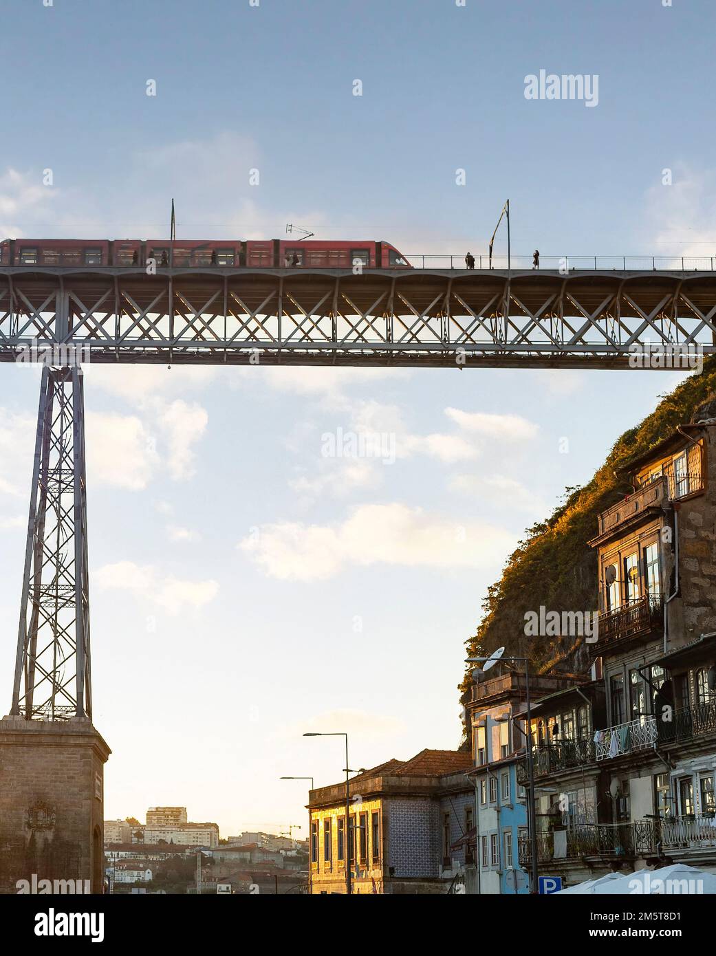 Scenic view of metro train at Luis bridge in sunset, Porto, Portugal ...