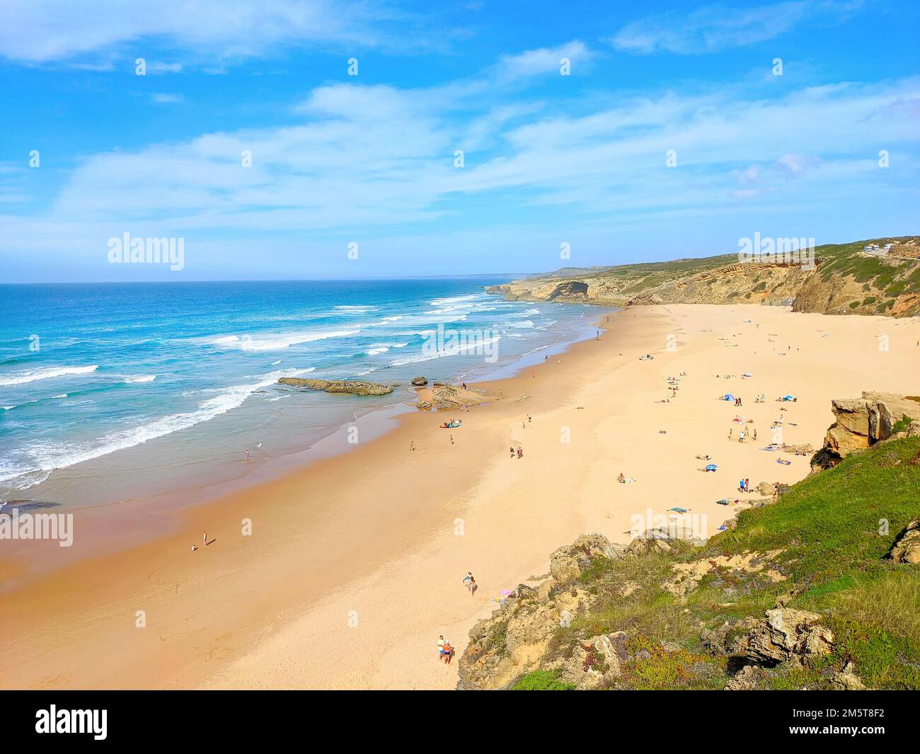 Aerial view of Monte Clerigo sandy beach, people sunbathing, sunshine ...