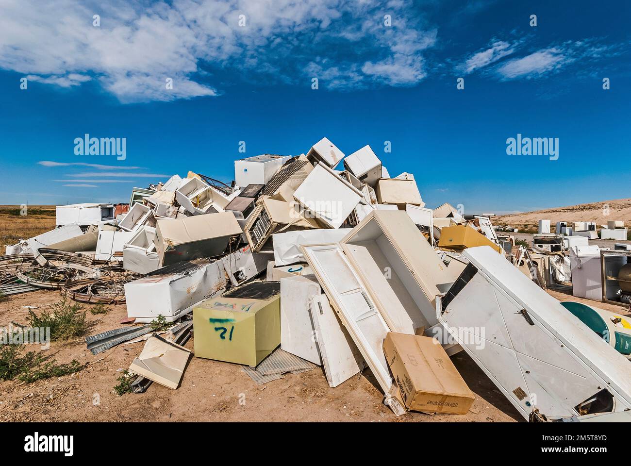 Appliances, scrap metal, refrigerators, and freezers gathered together ...