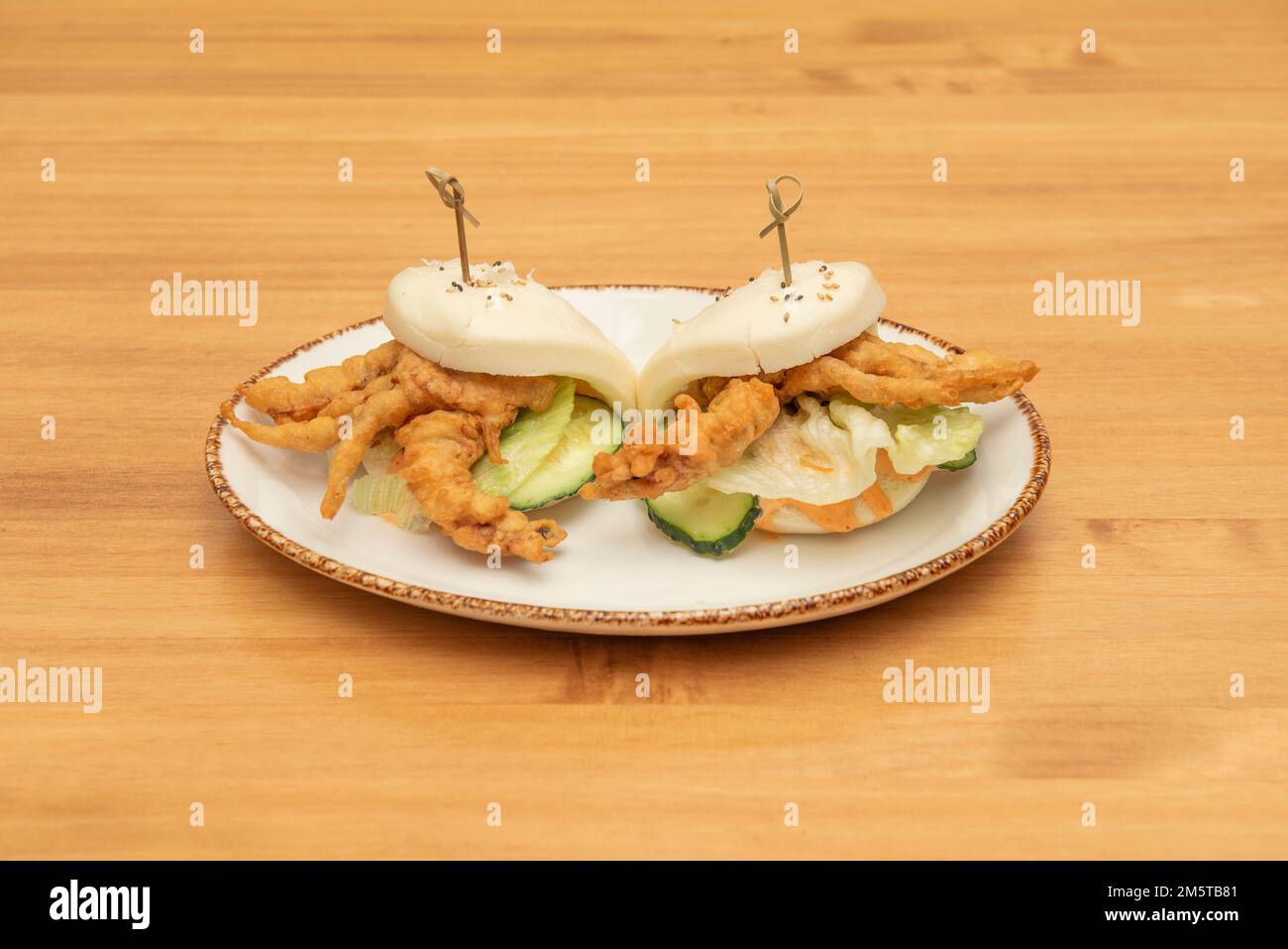 Small bites of bao bread with crabs in batter with vegetables Stock ...