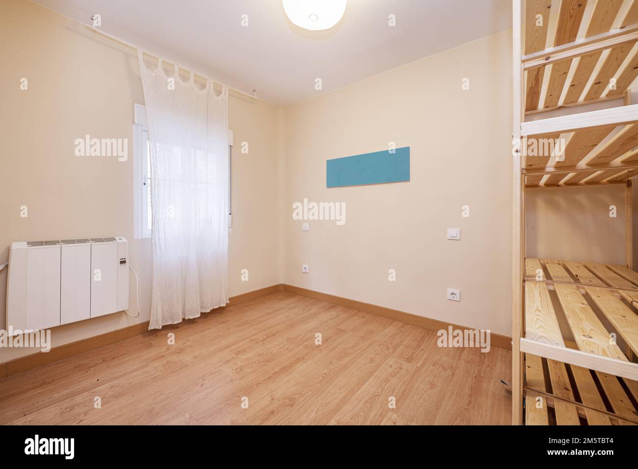 An empty room with empty cargo shelves made of unvarnished wood and ...