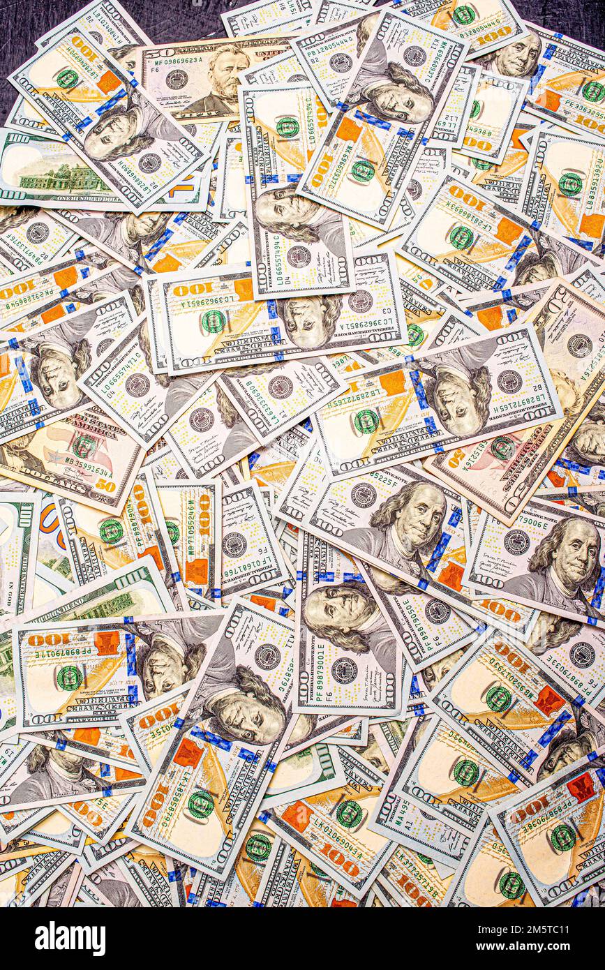 Money American currency on a black background. Vertical frame ...