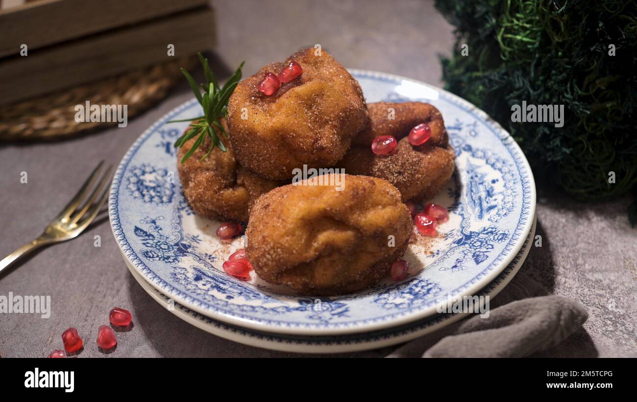 Rabanadas poveiras with sugar and cinnamon and some pomegranate seeds ...