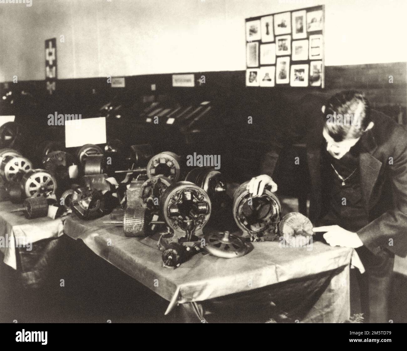Nikola Tesla in his laboratory working on motors Stock Photo - Alamy