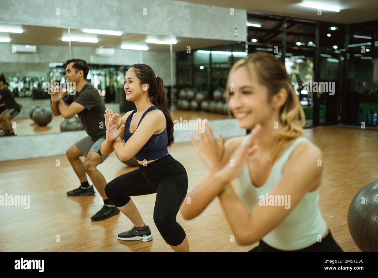 asian woman doing squat stance and hand defense with friend Stock Photo ...