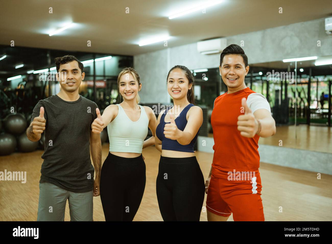 Group of diverse young friends with thumbs up during break Stock Photo ...