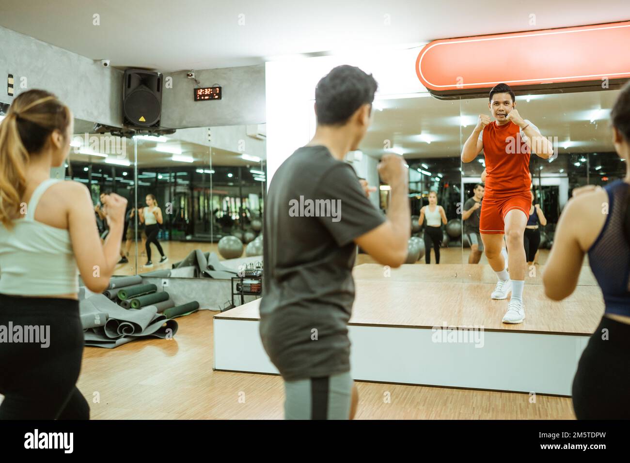the instructor performs a defensive stance during group exercises Stock ...