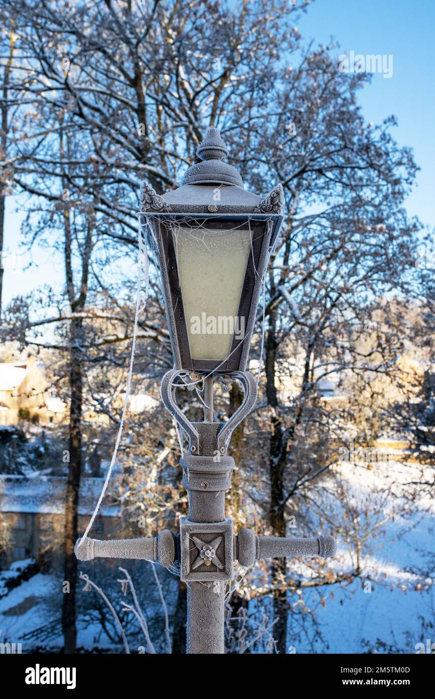 Icy lamp post in St Oswald's churchyard. Compton Abdale, Cotswolds ...