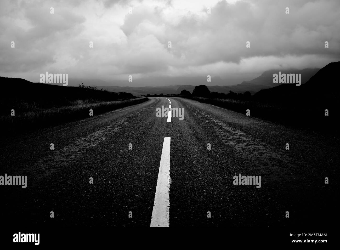 Asphalt road rocky mountains Black and White Stock Photos & Images - Alamy