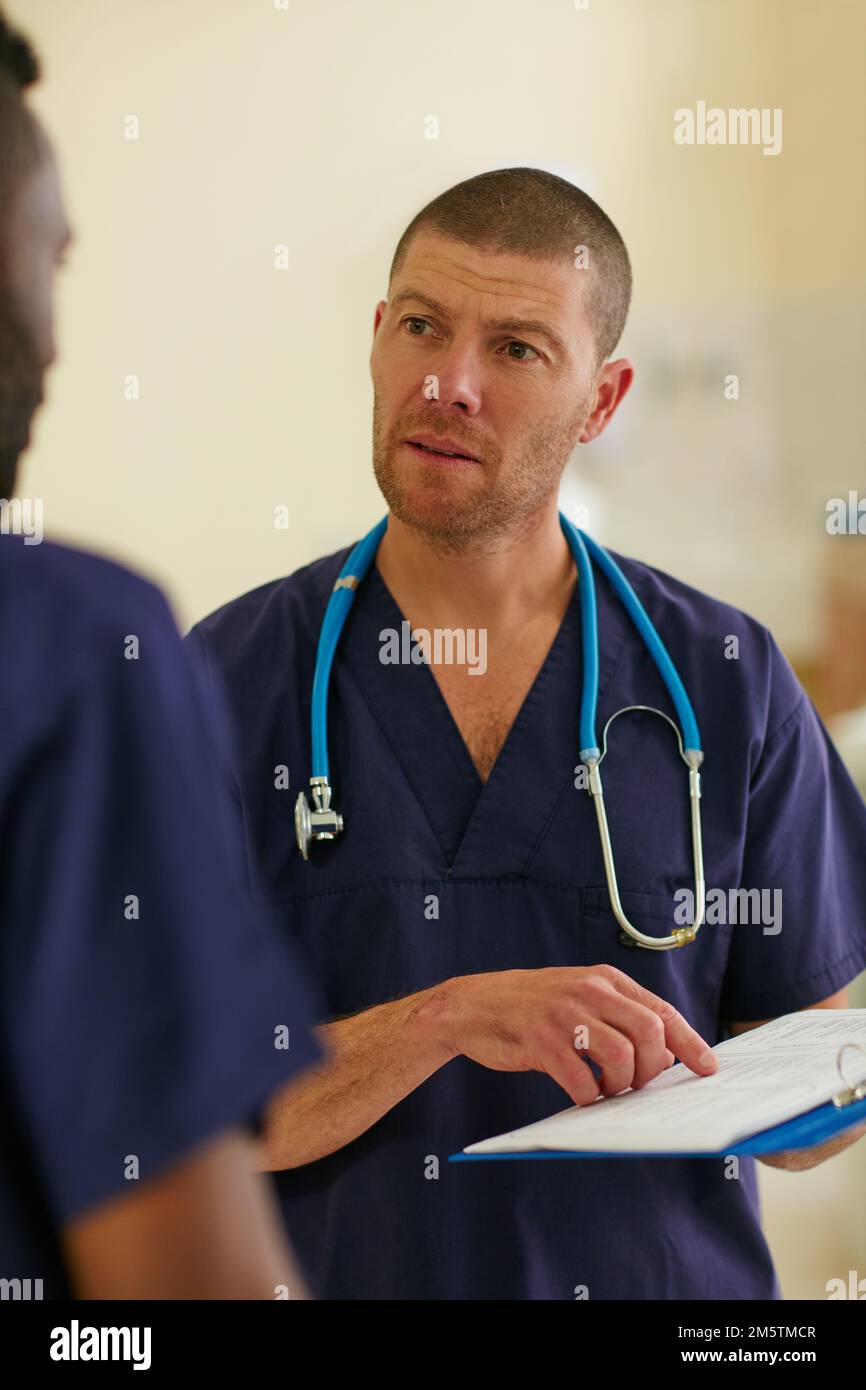 Do you have any of these symptoms. a doctor working in a hospital Stock ...