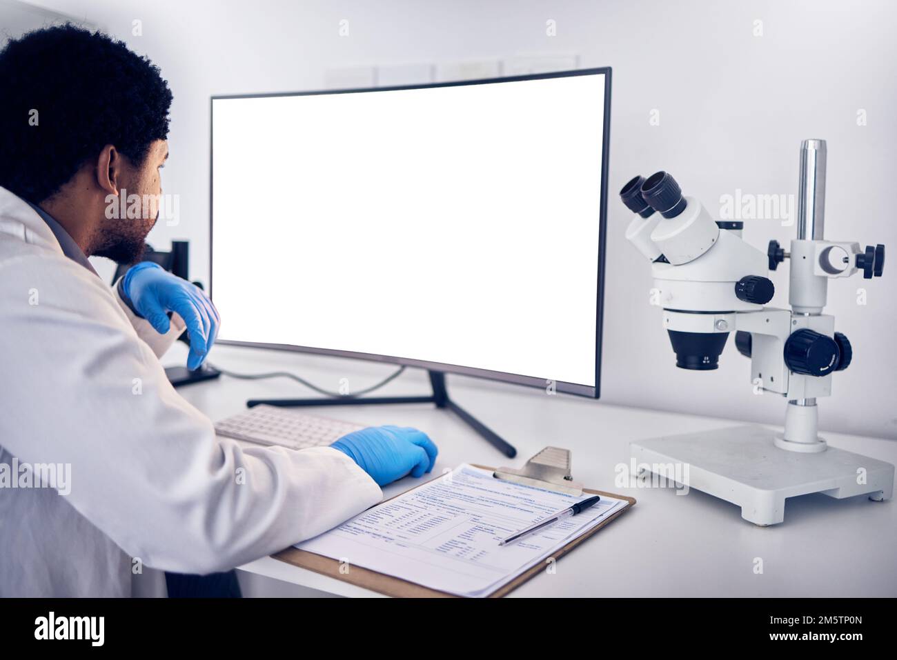 Mockup, science and black man with computer, research and typing for ...