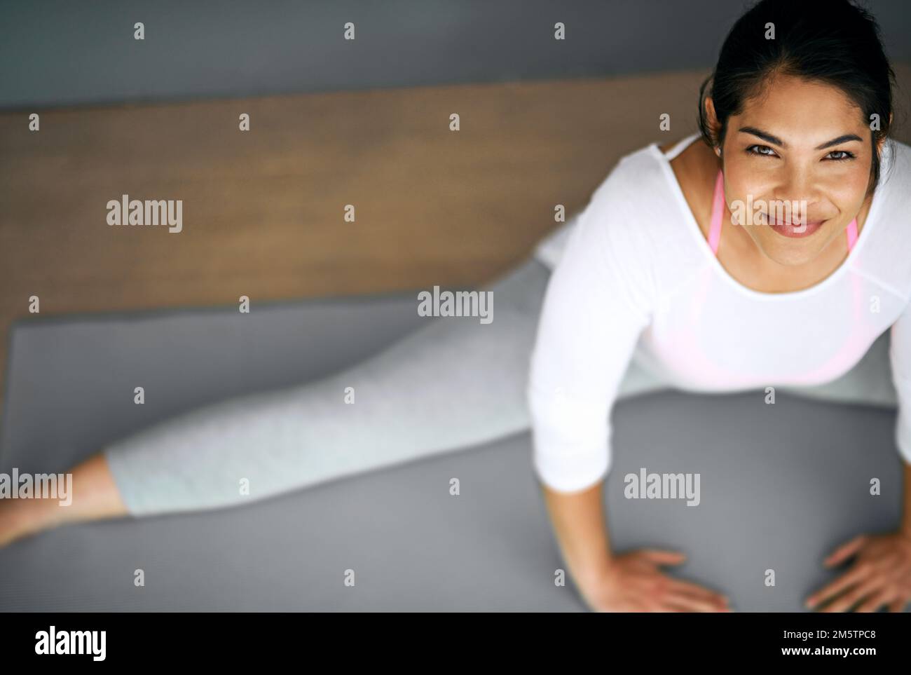 Yoga keeps me fit for me. Portrait of an attractive young woman doing ...