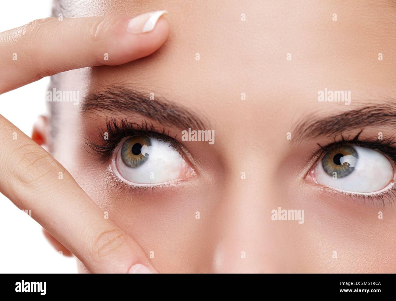 Its all in the eyes. Closeup studio shot of a beautiful young woman ...