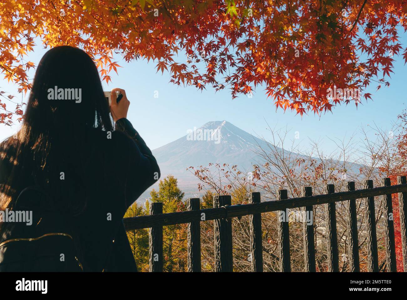 Girl taking pictures of a view of Mt Fuji during autumn Stock Photo - Alamy