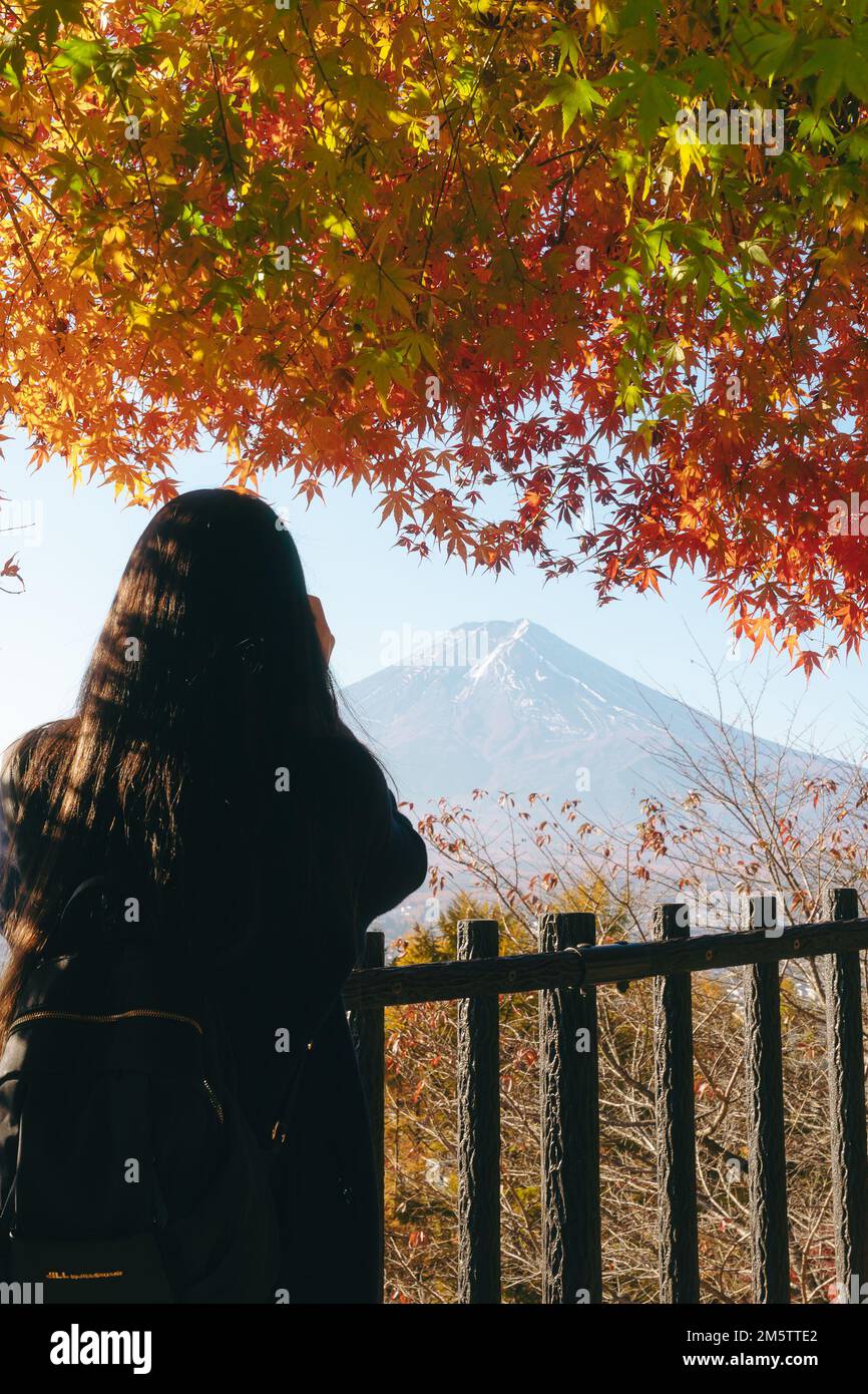Girl taking pictures of a view of Mt Fuji during autumn Stock Photo - Alamy