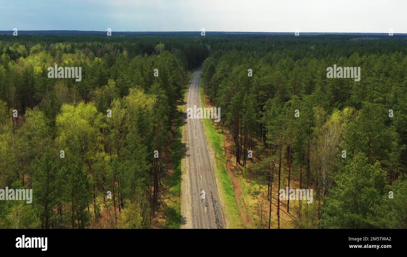 4K Aerial View Of Road Through Spring Mixed Forest Landscape. Top View ...