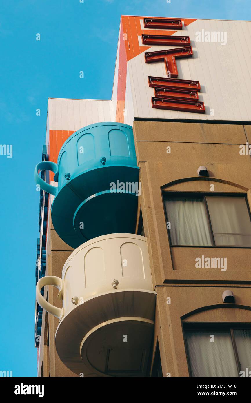 Teacup sculptures on a building facade Stock Photo - Alamy
