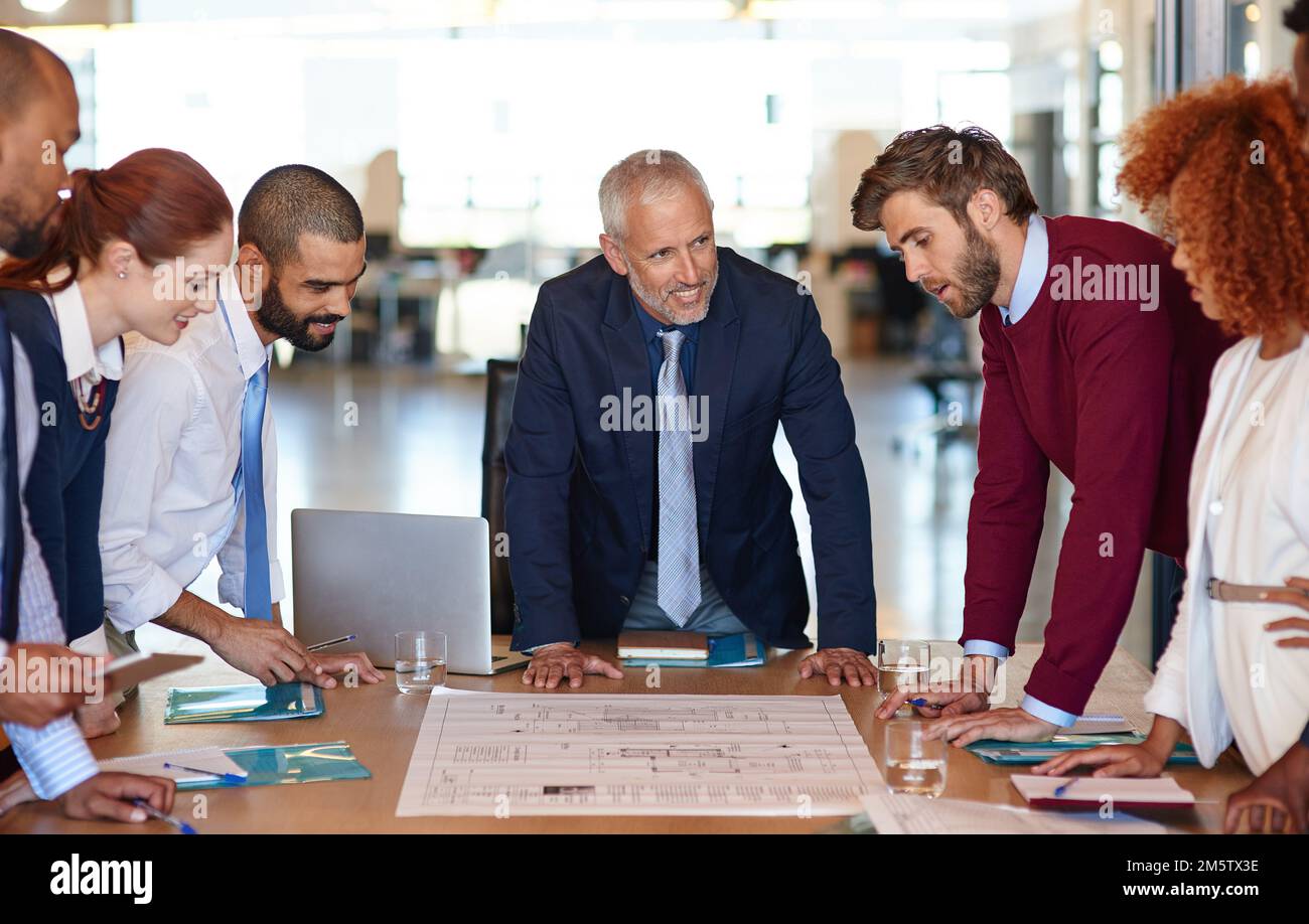 Finding the best business solutions. a group of businesspeople ...