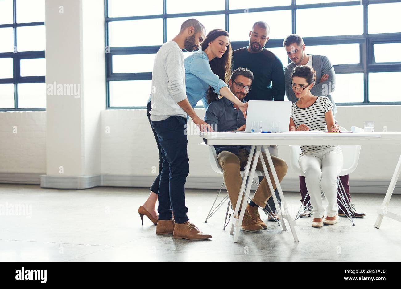 Its all hands on deck for their newest project. a group of coworkers ...