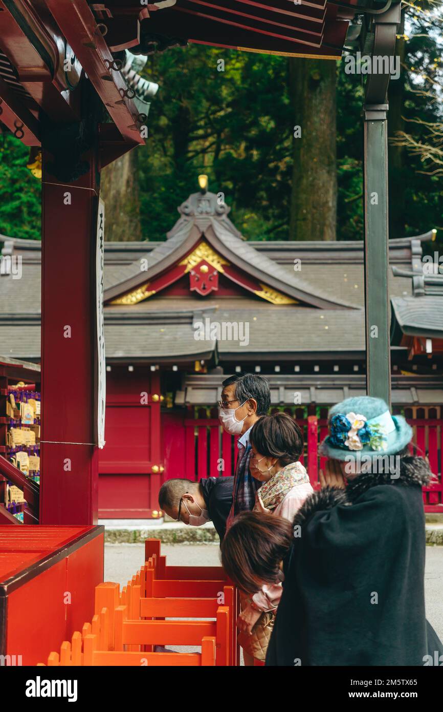 Japanese people praying at a shrine in Hakone Stock Photo - Alamy