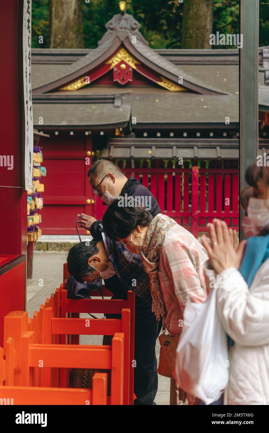 Japanese people praying at a shrine in Hakone Stock Photo - Alamy