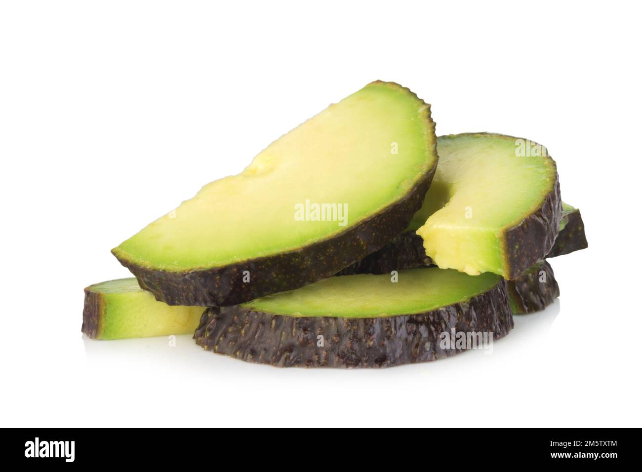 avocado piece pile isolated on white background Stock Photo - Alamy