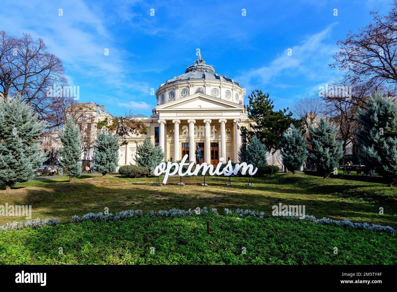Bucharest, Romania, 2 January 2022: Optimism word displayed in front of ...