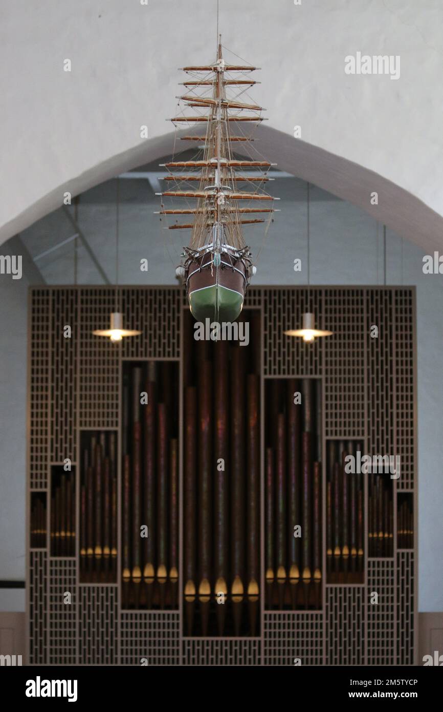 A vertical shot of a model of a ship hanging from a ceiling Stock Photo ...
