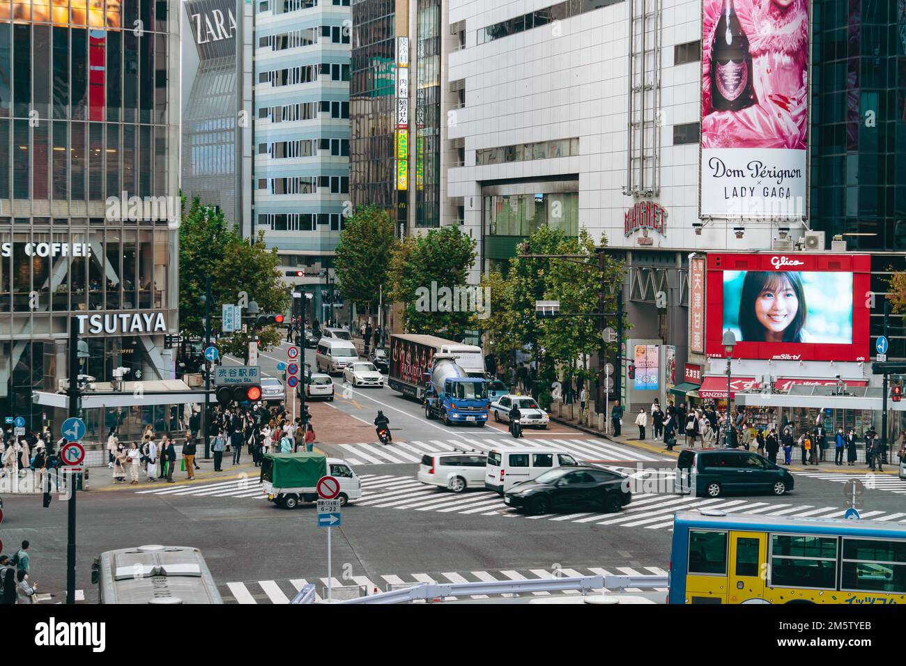 Public Vehicles driving through the Shibuya intersection Stock Photo ...