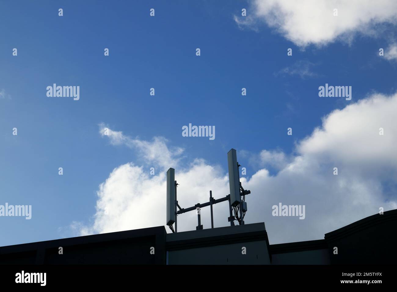 Australian mobile phone tower against blue sky Stock Photo - Alamy