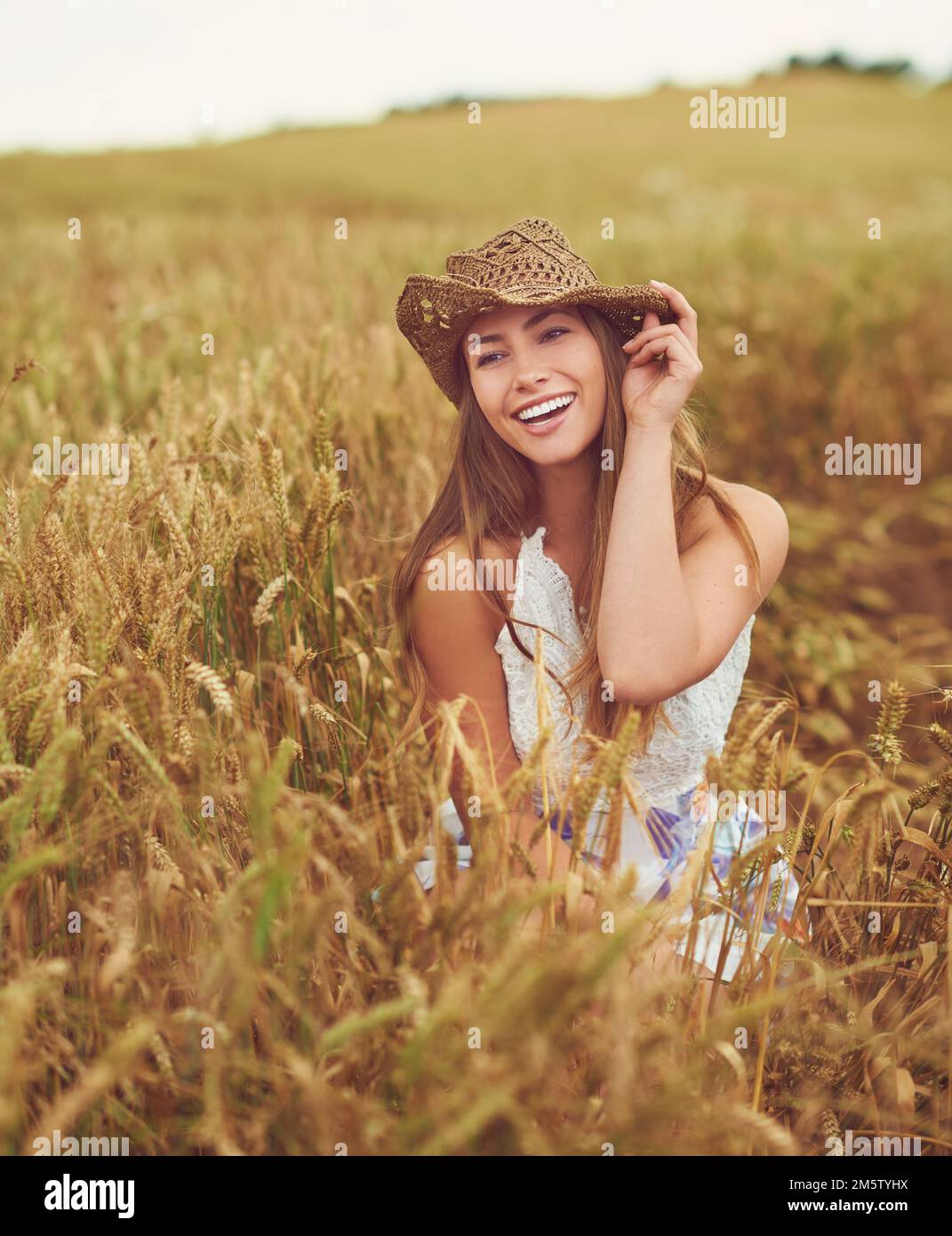 Sometimes this is all you need. a young woman in a wheat field Stock Photo - Alamy