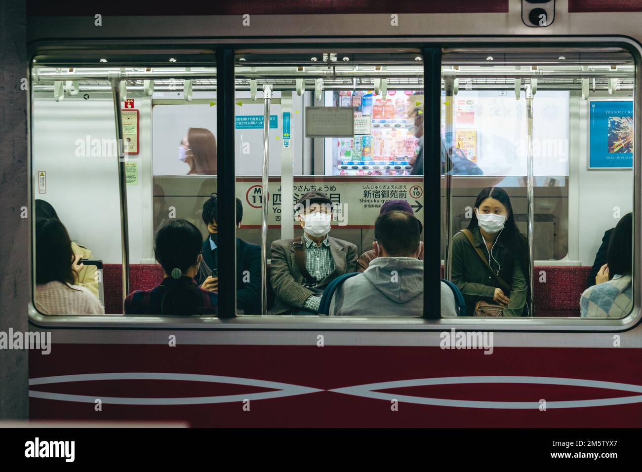 Passengers wearing mask in the train in Tokyo Stock Photo - Alamy