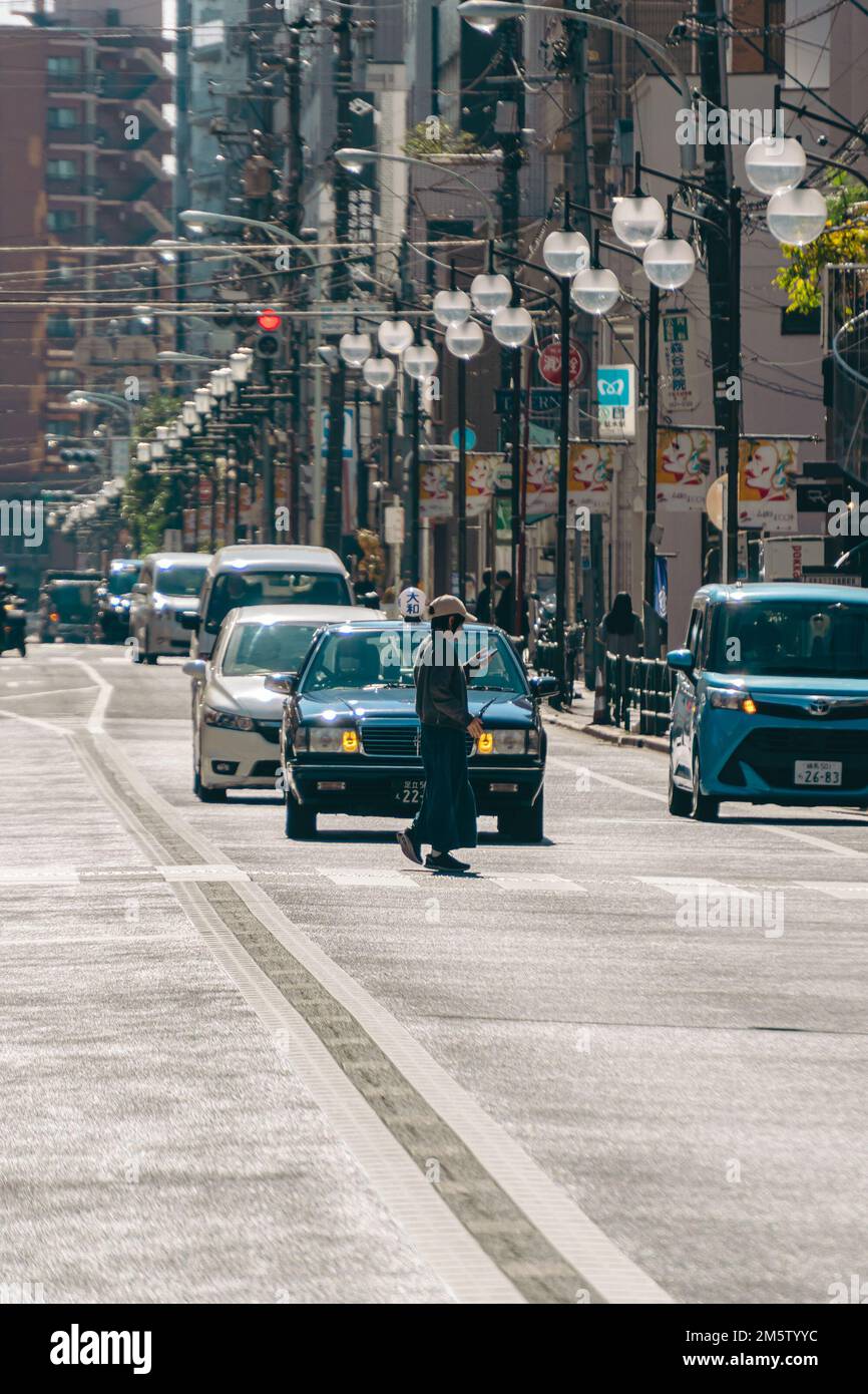 Person crossing the street hi-res stock photography and images - Alamy