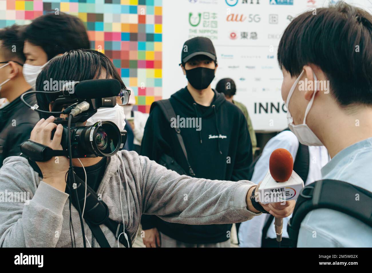 A film crew holding a public interview at Shibuya Stock Photo - Alamy